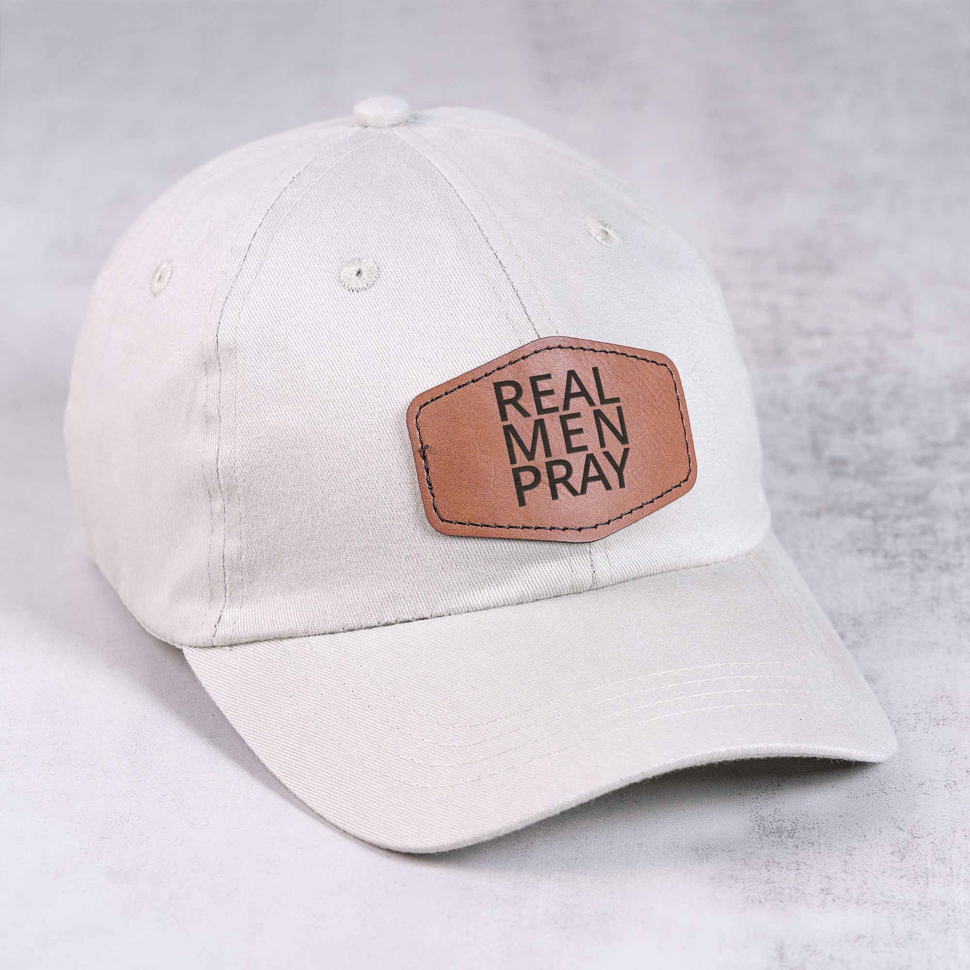 Real Men Pray Leather Patch Ball Cap - stone | The Catholic Company®
